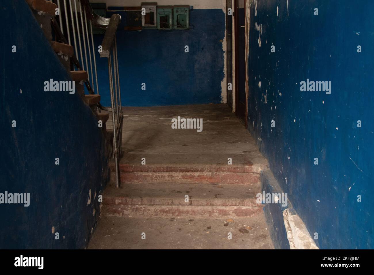 old soviet dirty dark staircase at the entrance of an apartment ...