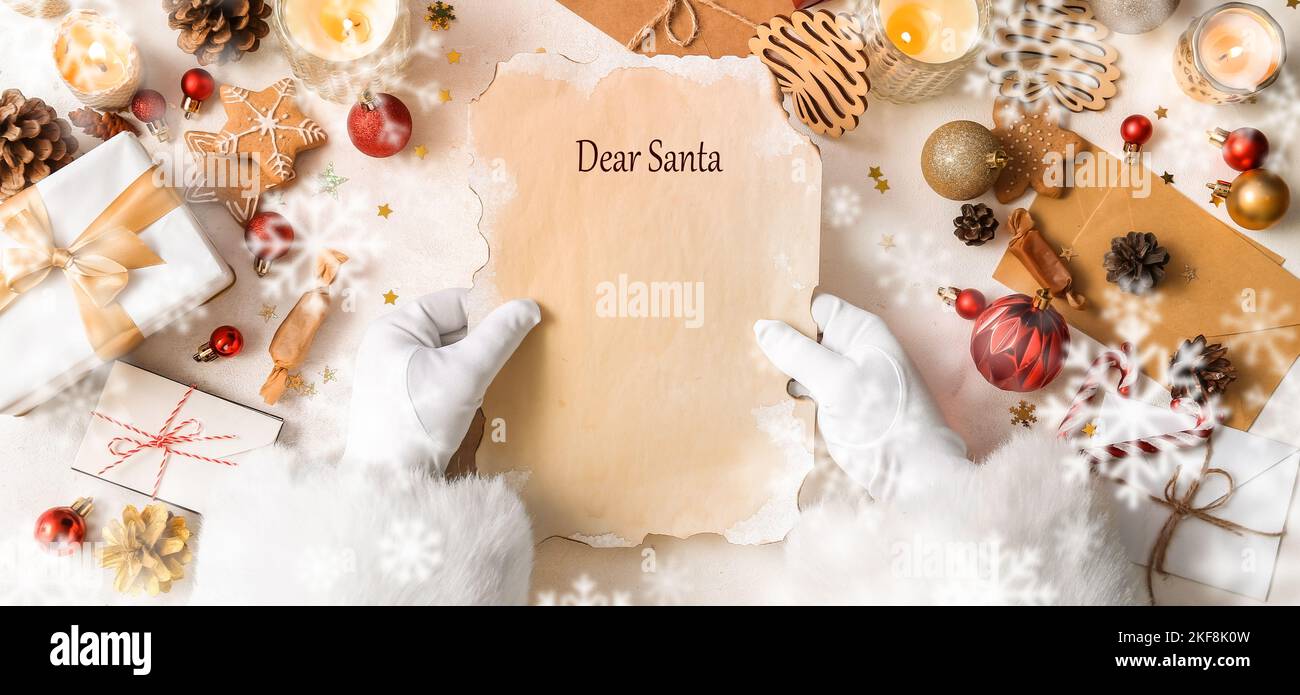 Santa Claus with blank letter at white table, top view Stock Photo - Alamy