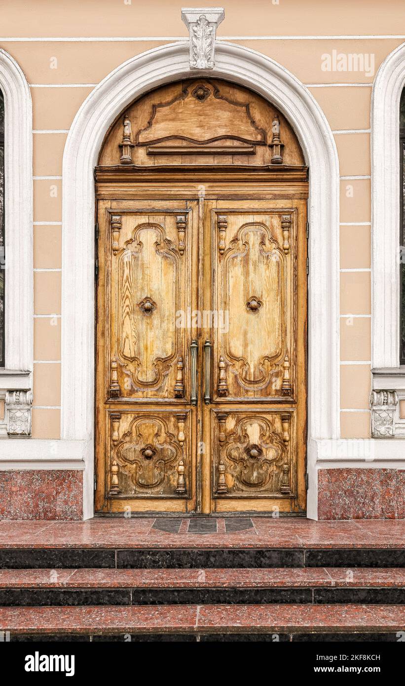 Building with beautiful wooden door Stock Photo - Alamy