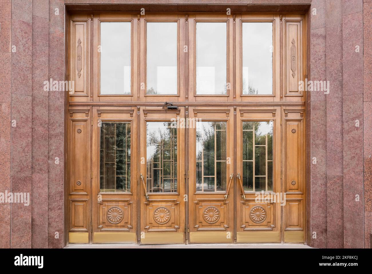 Building with big wooden doors Stock Photo - Alamy