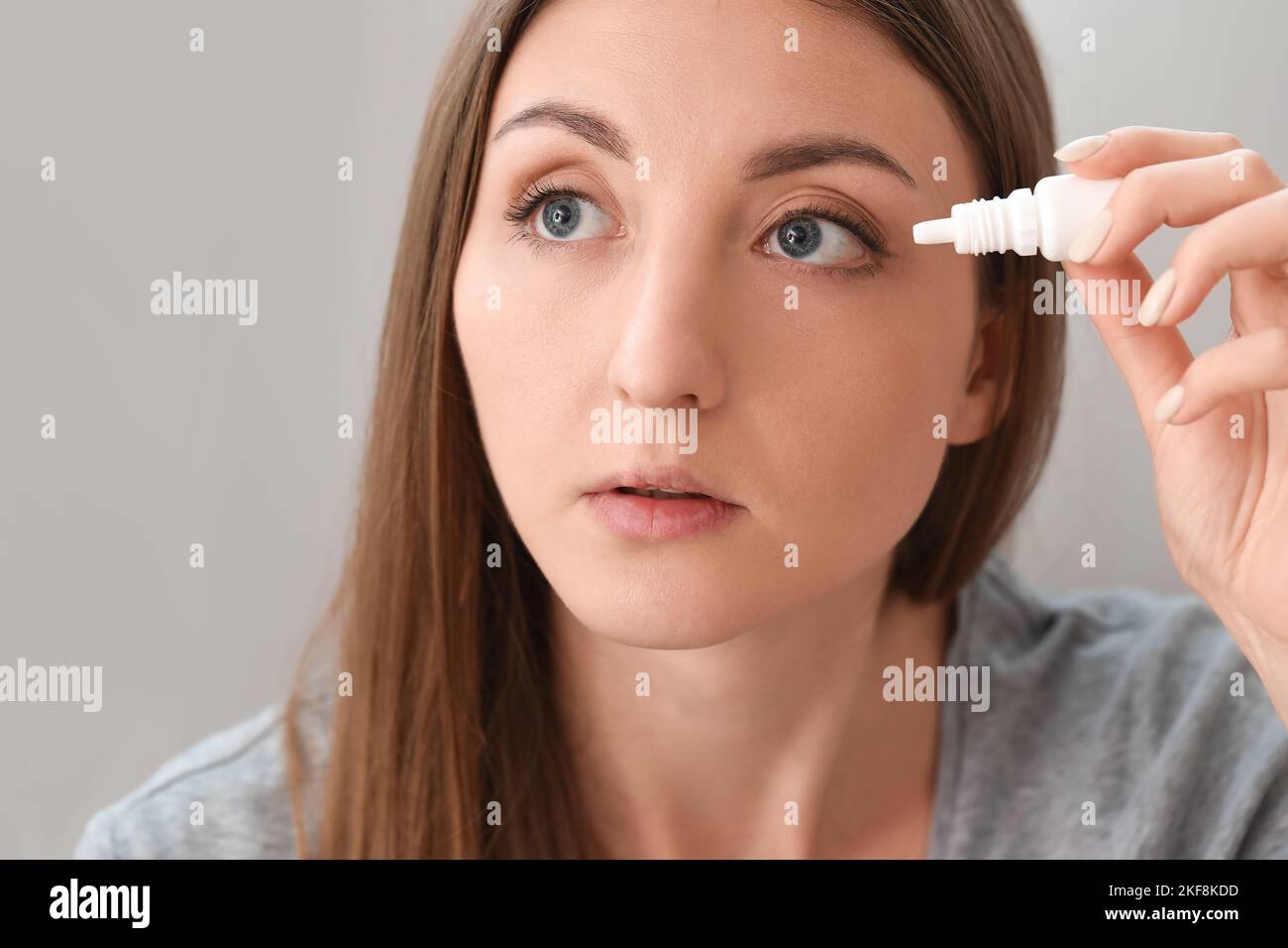 Beautiful woman using eye drops at home, closeup Stock Photo - Alamy