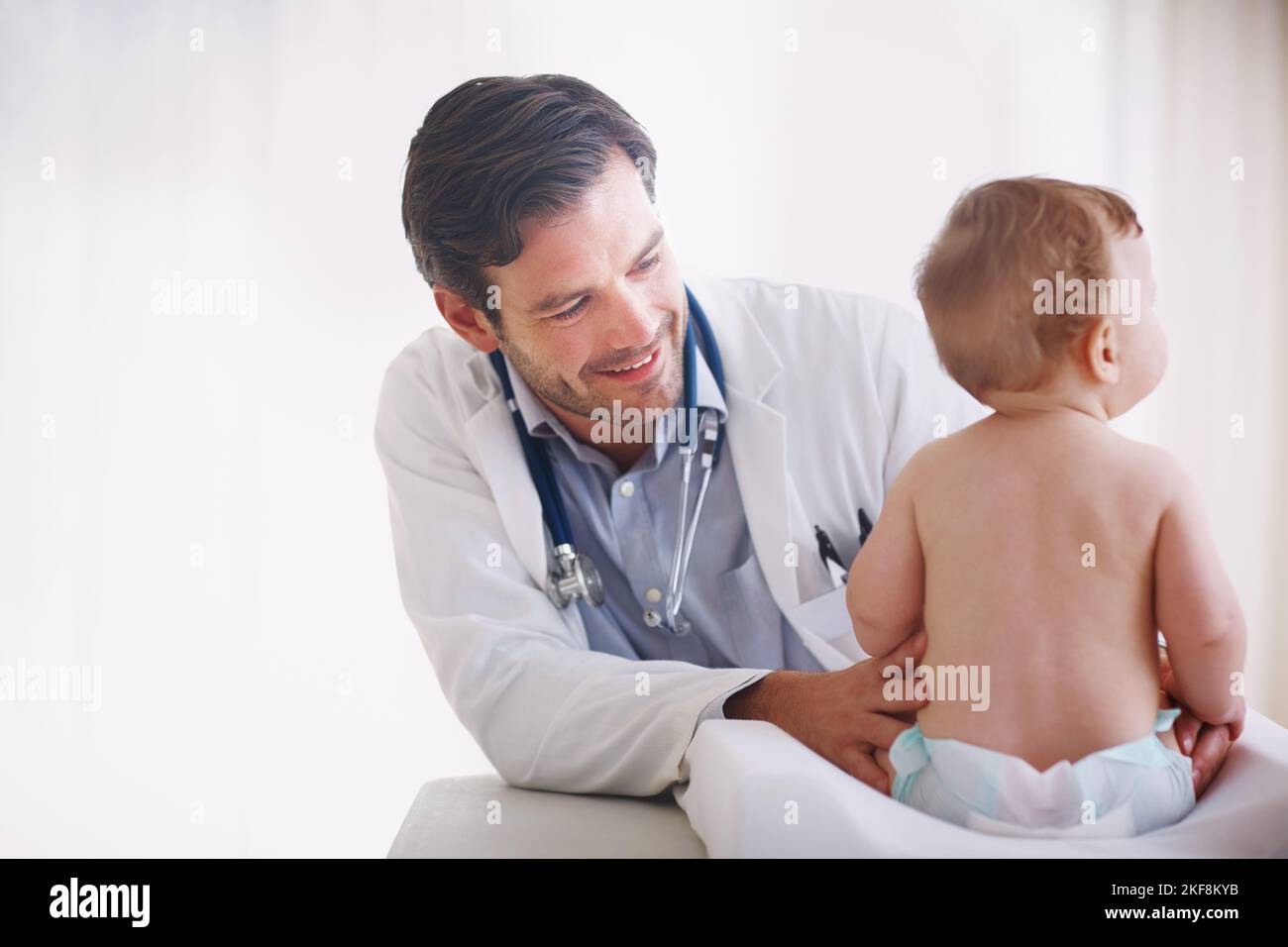 He really cares about his patients wellbeing. A young male doctor ...
