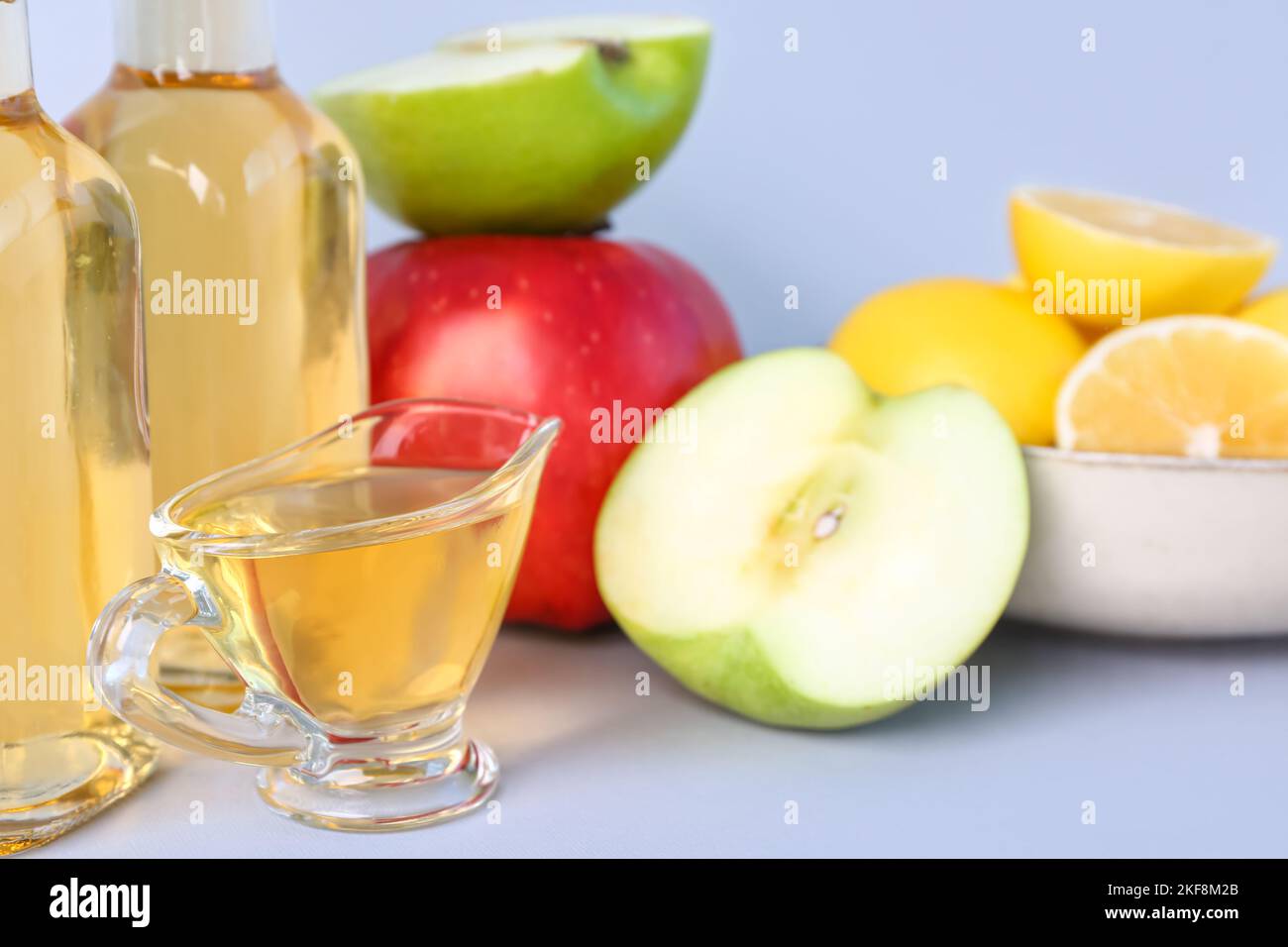 Gravy boat with apple cider vinegar on light background, closeup Stock ...