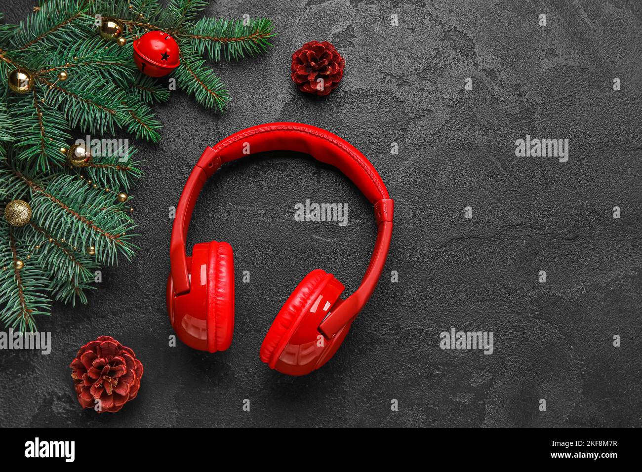 Composition with modern headphones, fir branches and Christmas ...