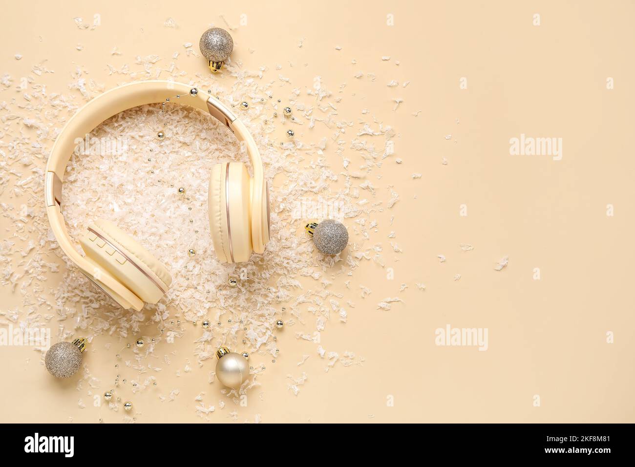 Composition with modern headphones, snow and Christmas decorations on ...