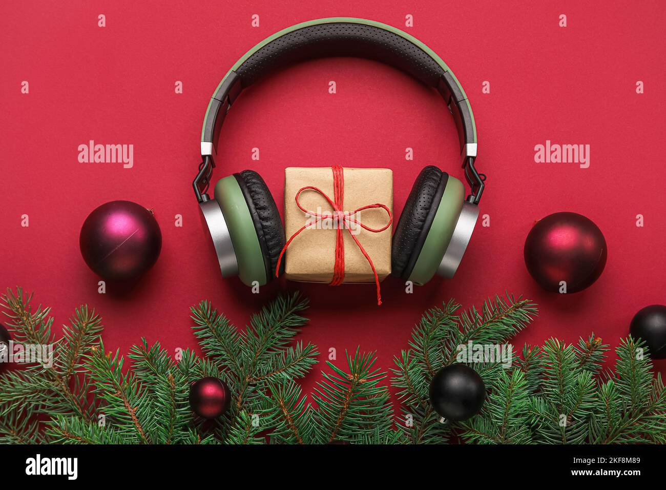 Composition with modern headphones, Christmas gift, balls and fir ...