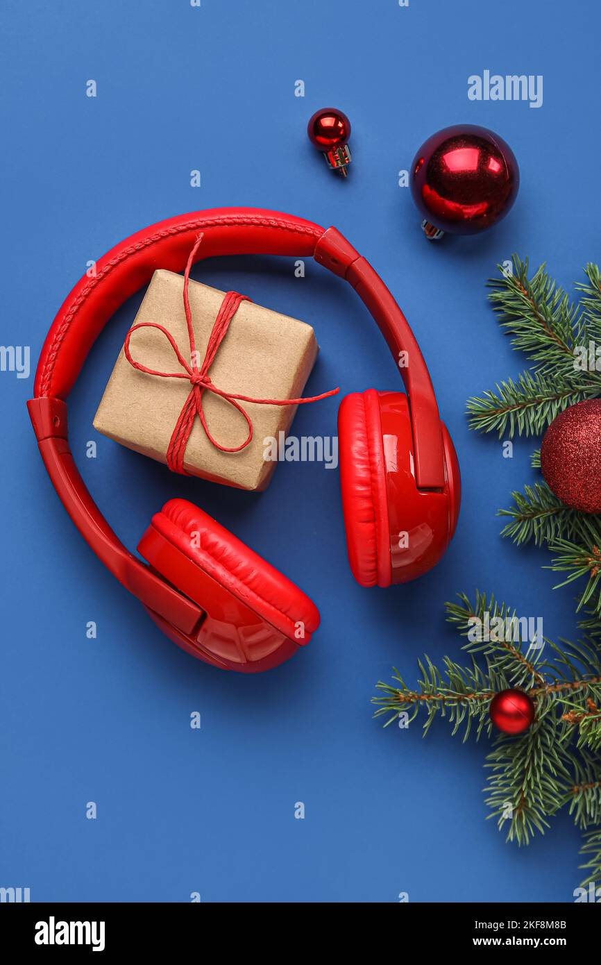 Composition with modern headphones, Christmas gift, balls and fir ...