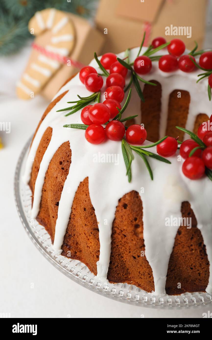 Dessert stand with traditional Christmas cake on light table, closeup ...