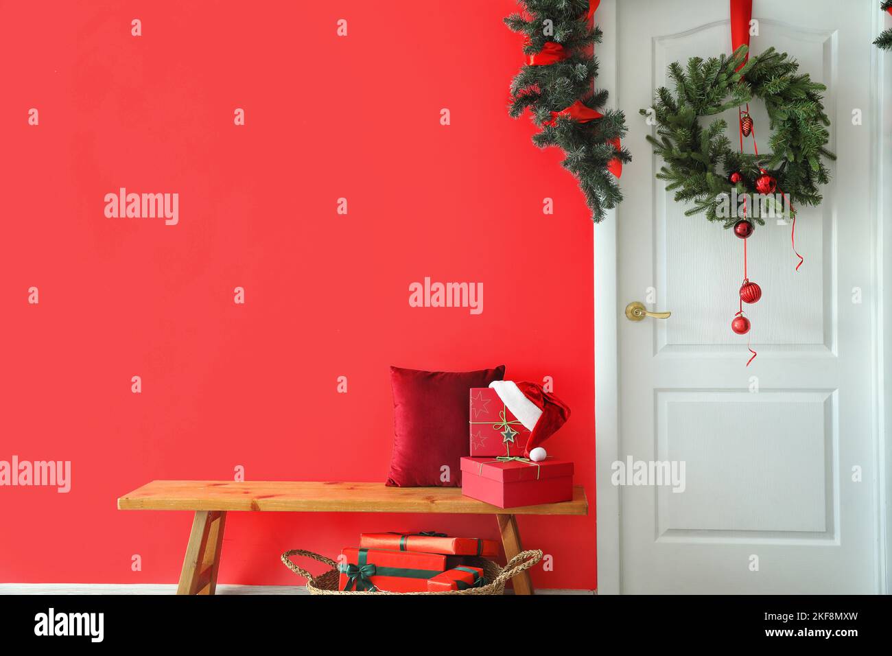 Interior of hall with white door, bench and Christmas decor Stock Photo ...