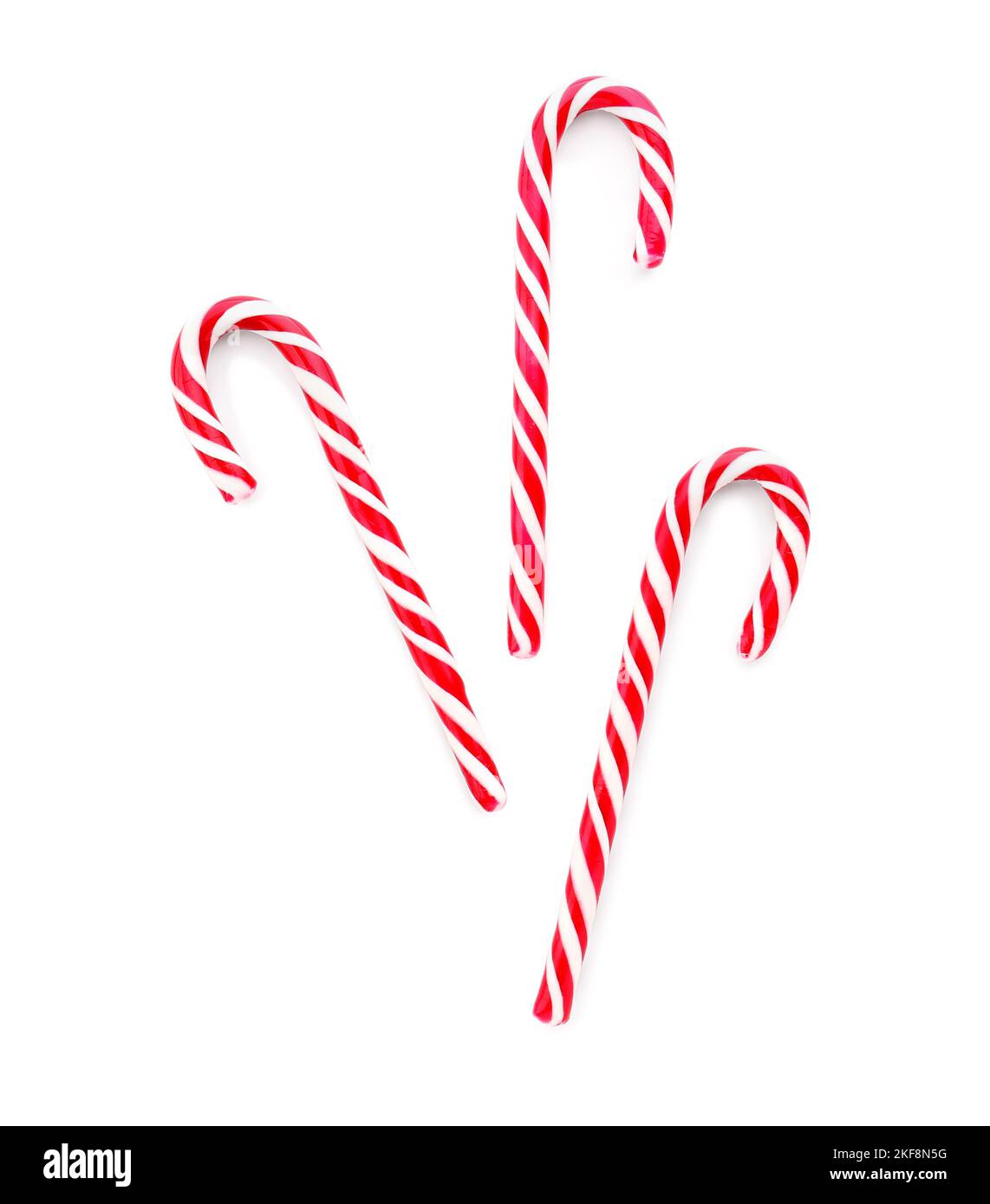 Delicious candy canes on white background Stock Photo - Alamy