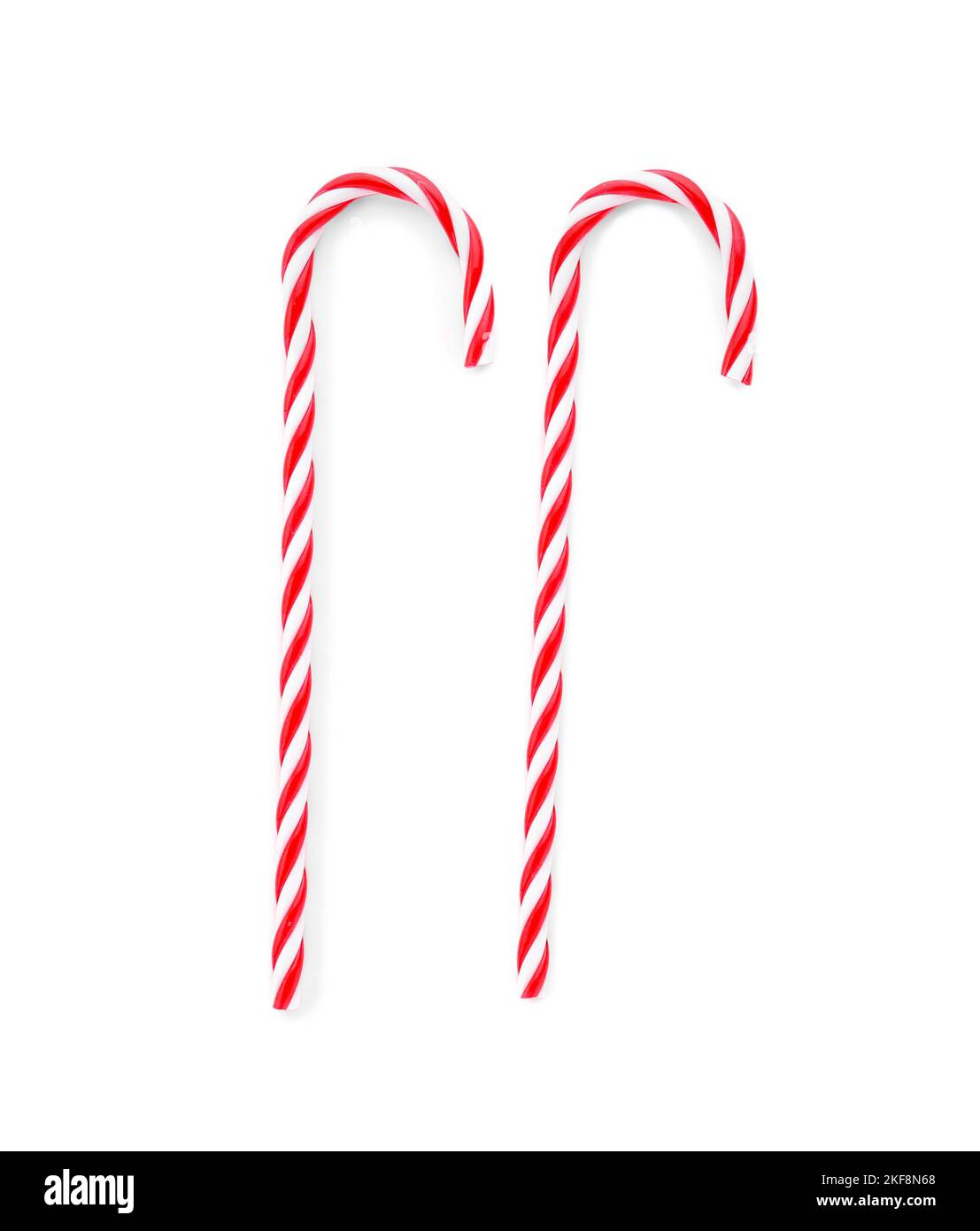 Sweet candy canes isolated on white background Stock Photo - Alamy
