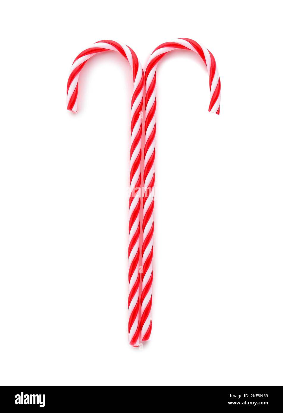 Sweet candy canes isolated on white background Stock Photo - Alamy