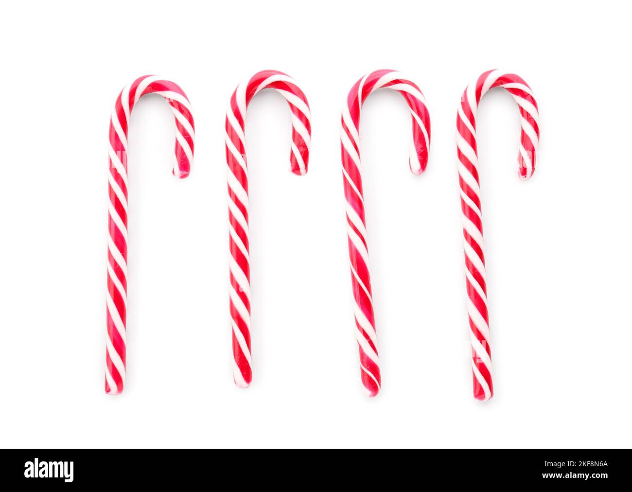 Delicious candy canes isolated on white background Stock Photo - Alamy