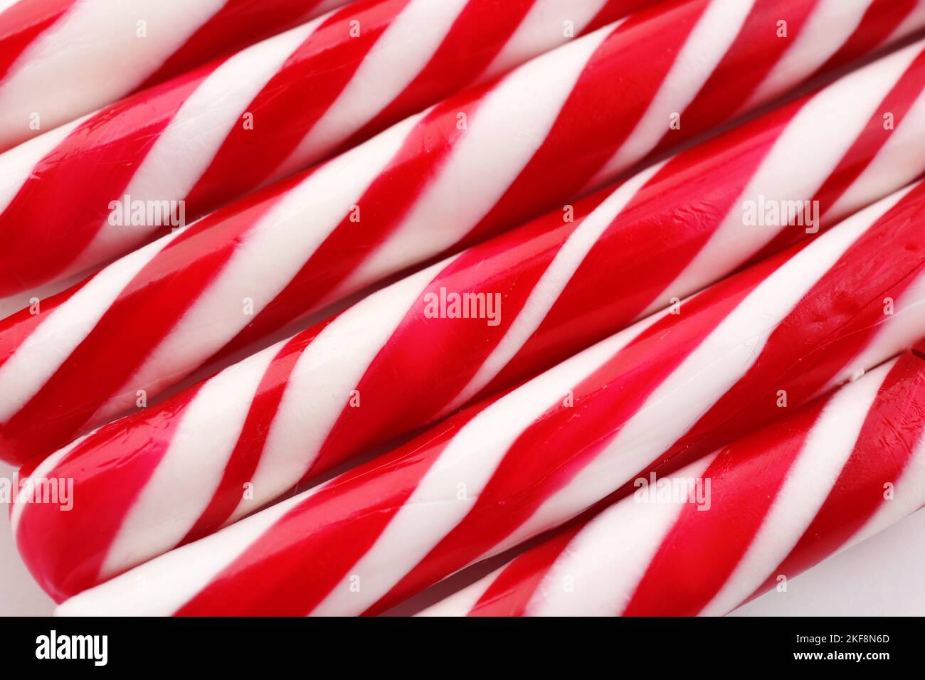 Delicious candy canes as background, closeup Stock Photo - Alamy