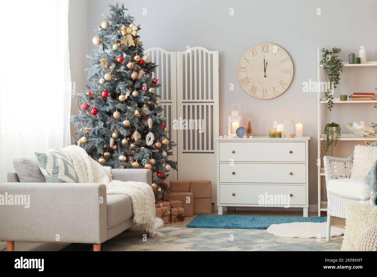 Interior of living room with clocks, drawers and Christmas tree Stock ...