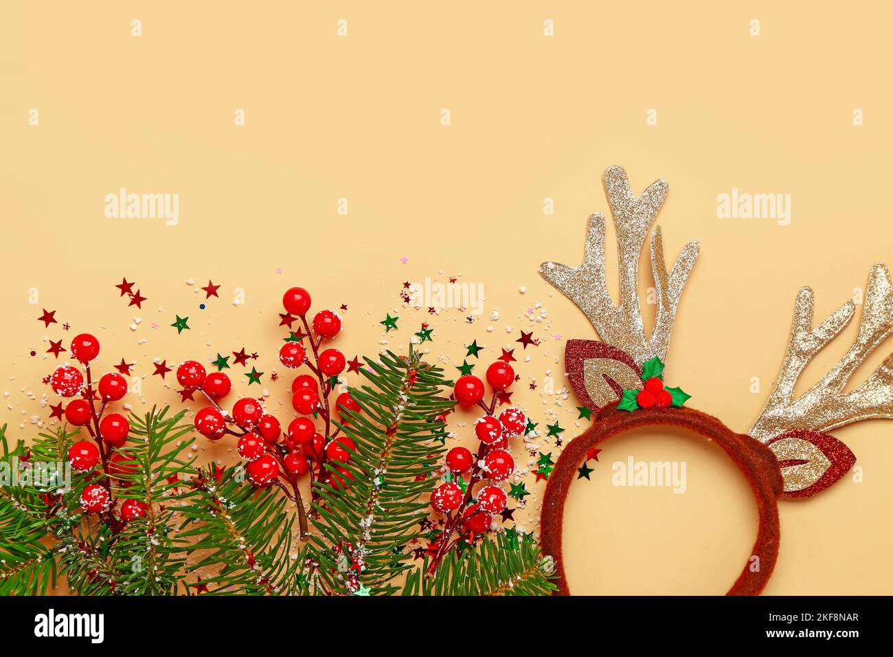 Composition with Christmas reindeer horns, fir branches and red berries ...