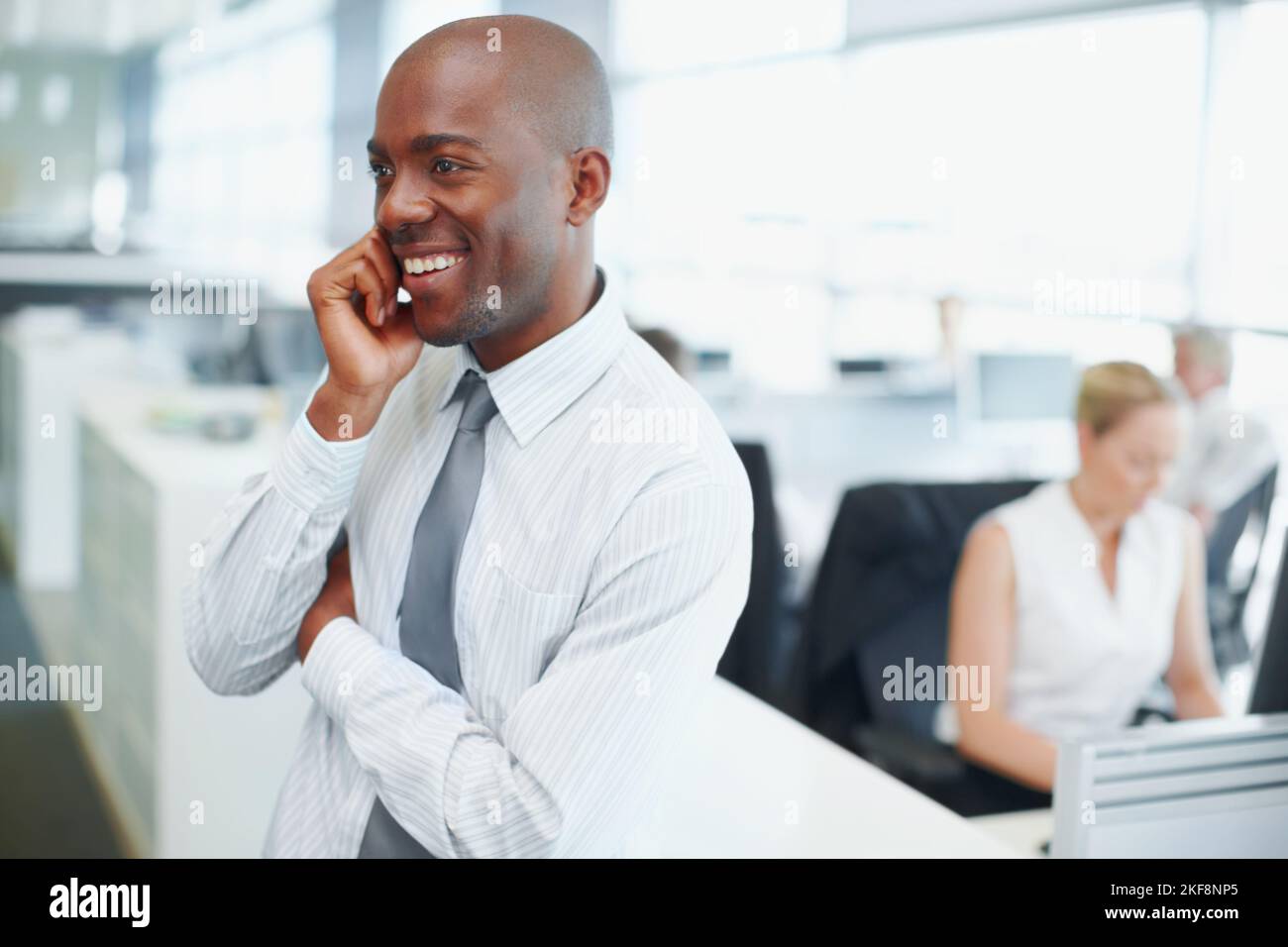 Hes on a first name basis with his clients. Positive young African ...