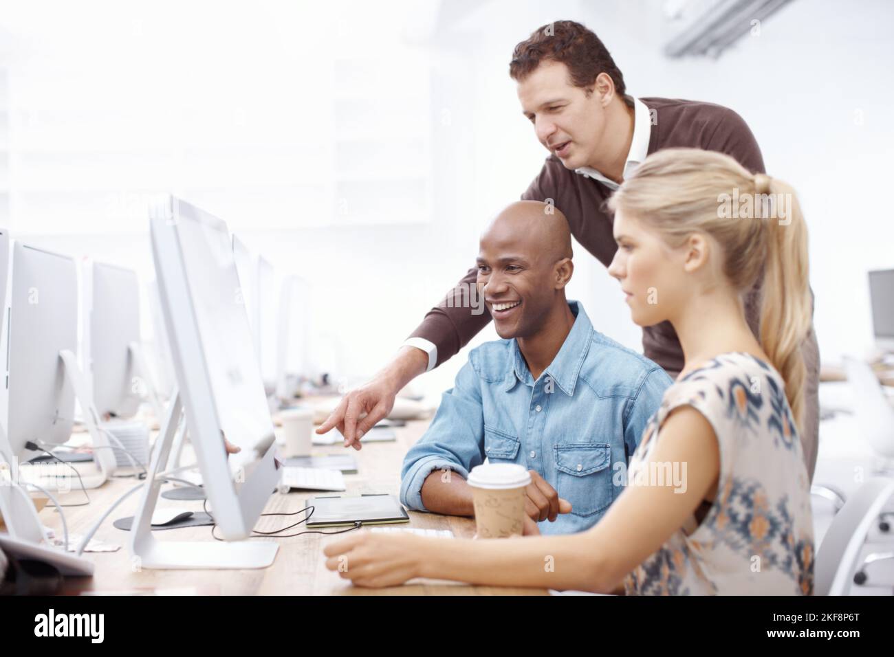 I like the tabs at the bottom. Two colleagues hard at work while their ...