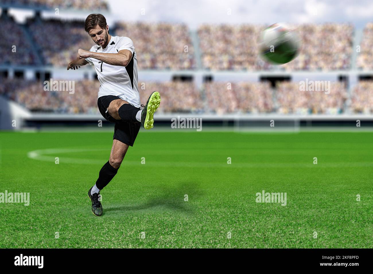 Soccer player kicking the ball Stock Photo - Alamy