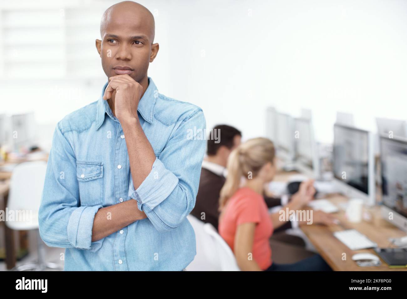 Thinking about business - Corporate strategies. A young businessman ...