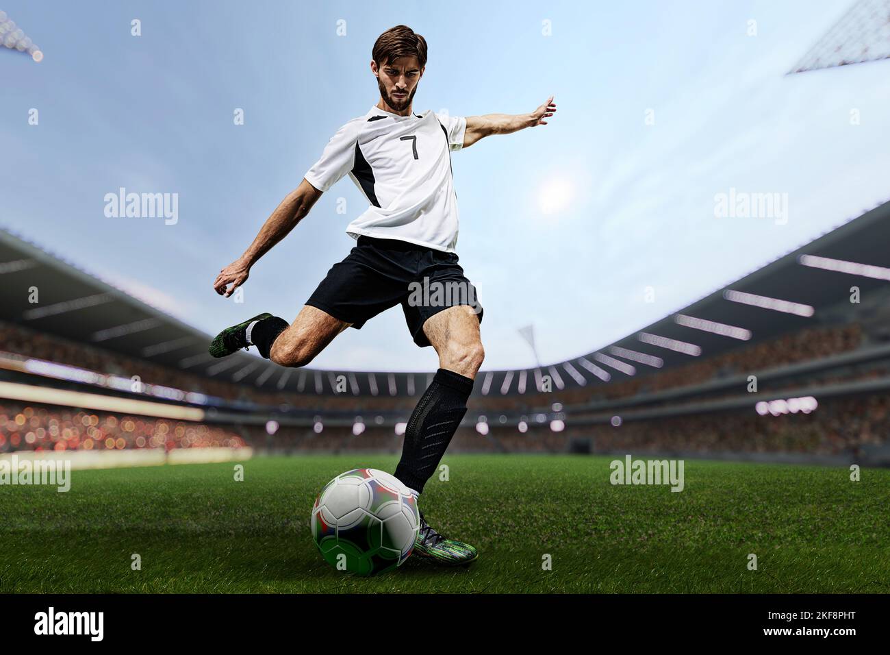 Soccer player kicking the ball Stock Photo - Alamy