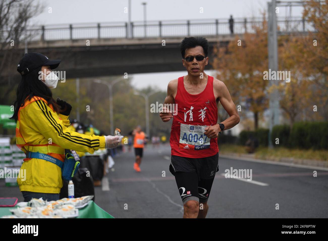 Participants run at the Beijing Marathon in Beijing, China, 6 November ...