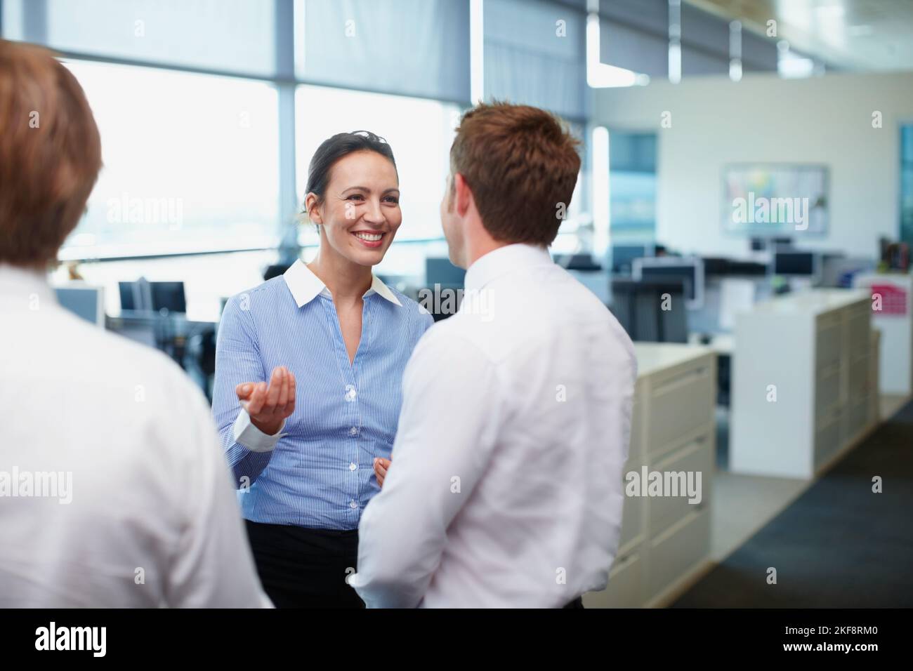 Business people friendly conversing. Beautiful business woman having ...