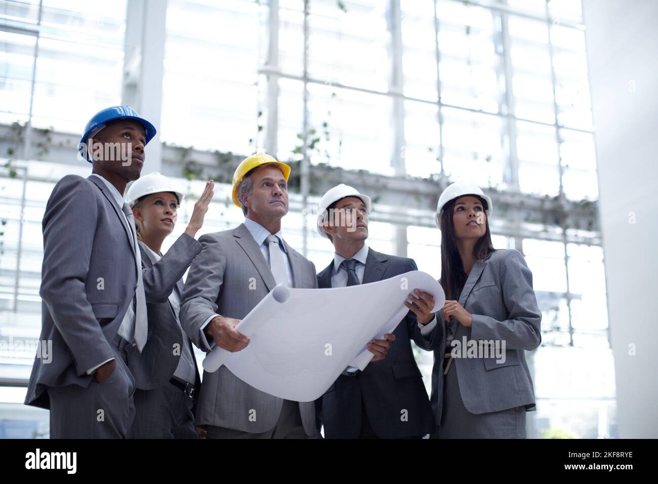 Making an on-sight inspection...A low angle shot of a diverse group of ...