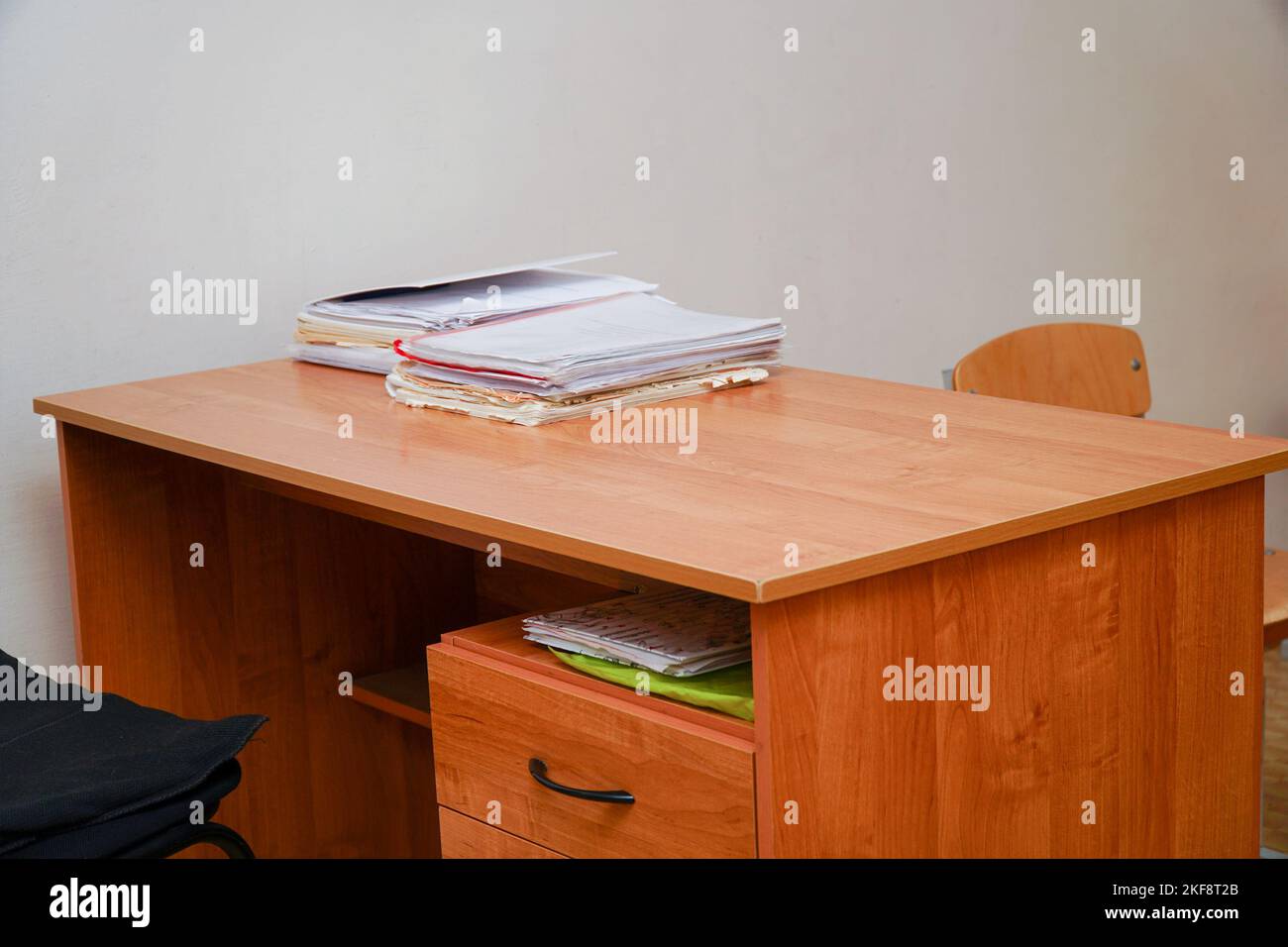 A stack of papers on a desktop without a computer Stock Photo - Alamy
