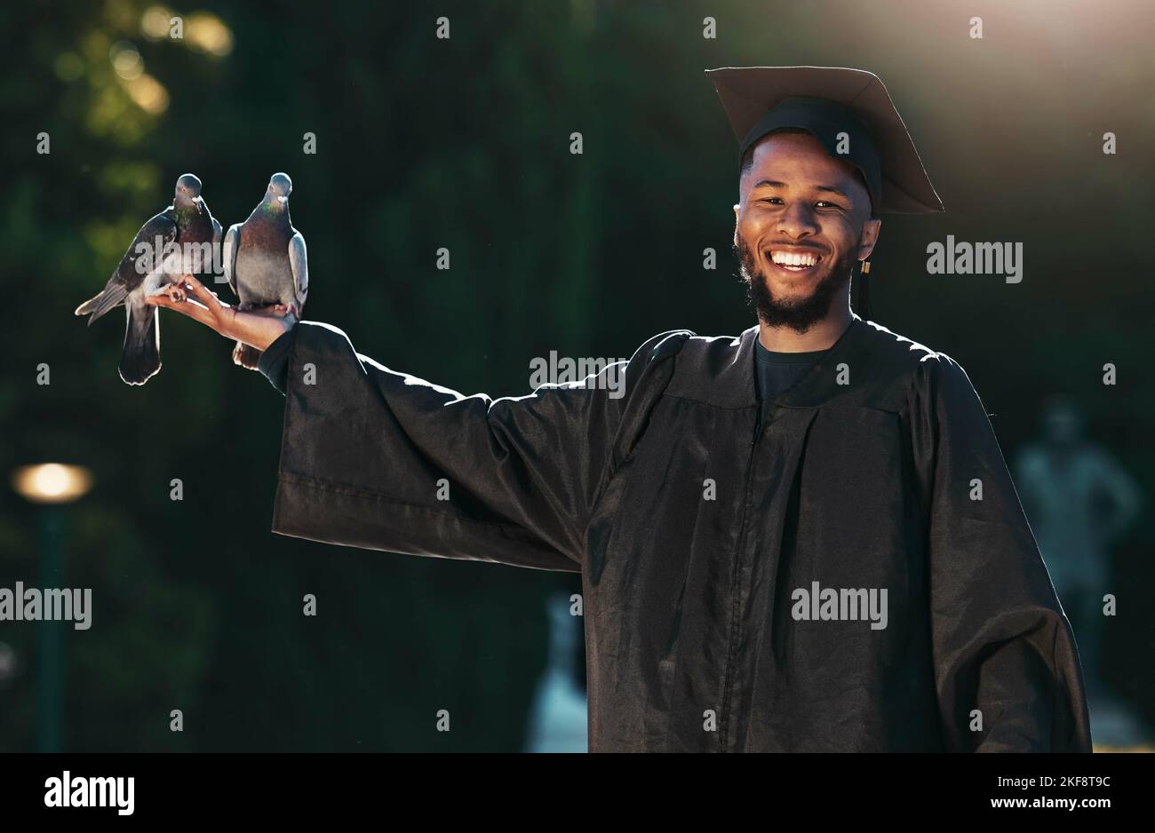 Student portrait, graduate and pigeon with a smile, hat and cloak for ...