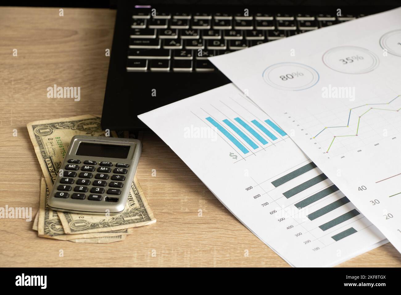 reports and histograms on paper on the table, analytics and statistics ...