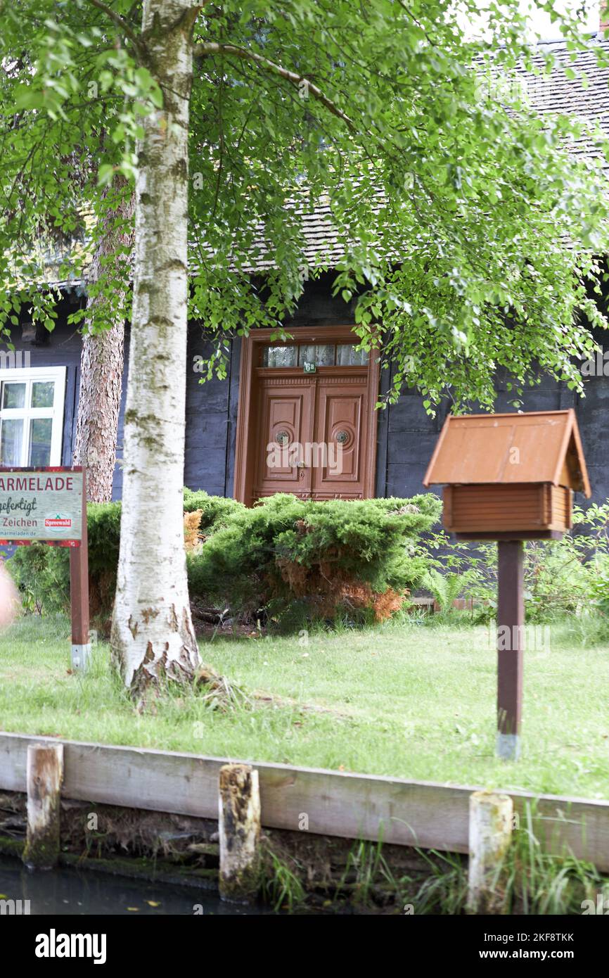 A house building facade surrounded by bushes in Spreewald Stock Photo ...