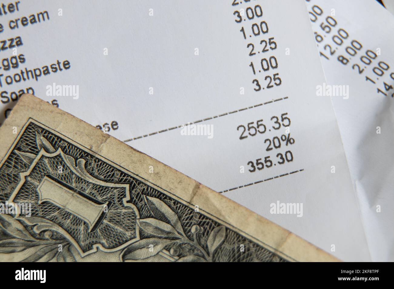 a check from the supermarket is on the table, a paper check with ...