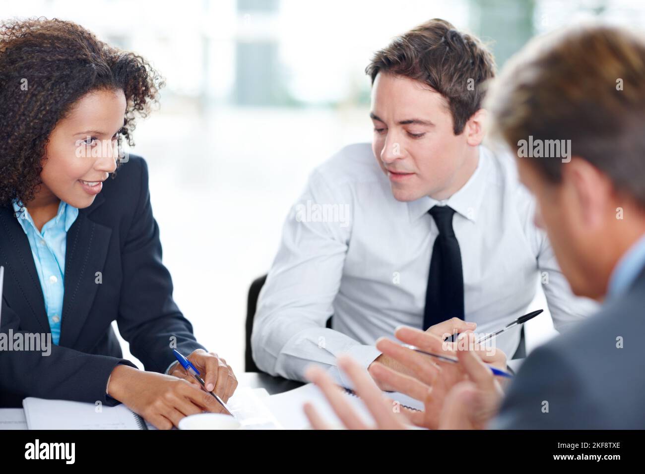 Sharing plans for the future. Inspired and positive business colleagues ...