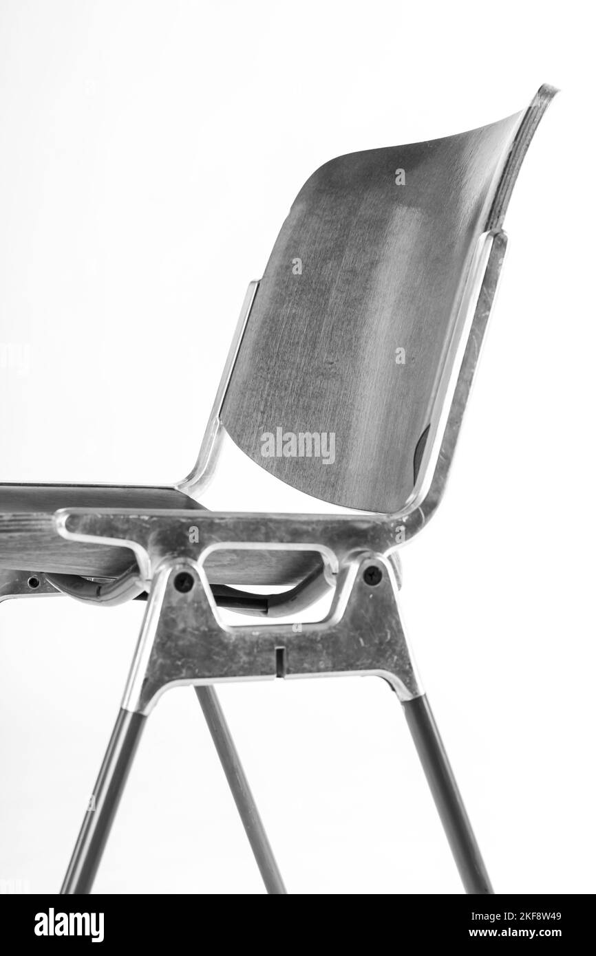 A vertical shot of a black corporate chair isolated on a white ...