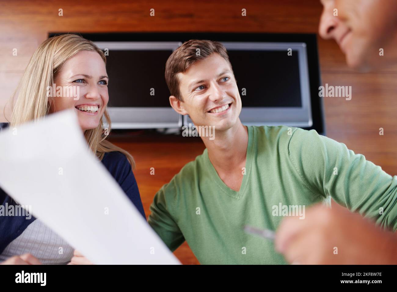 Ready to invest in their future. A young couple getting expert advice ...