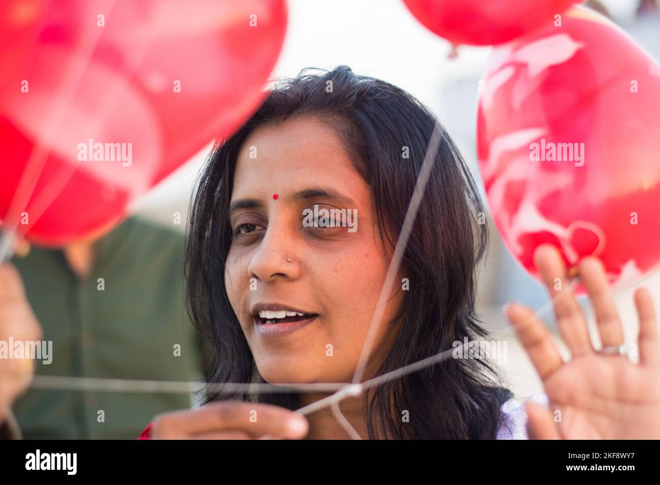Happy Indian Woman Playing with Balloons During a Festival in India ...