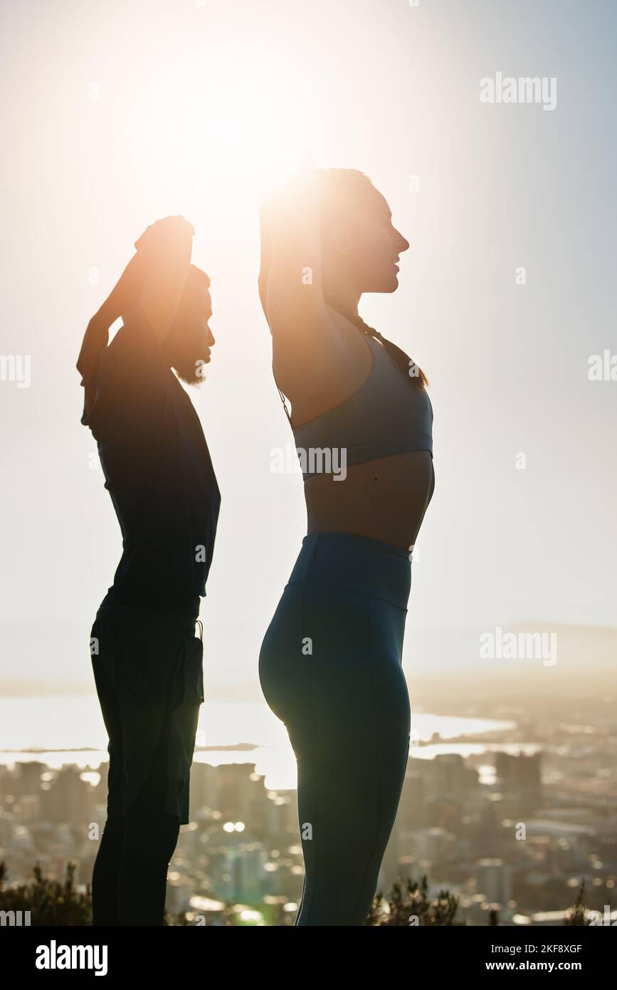 Fitness, sunset and couple doing an outdoor exercise or training ...