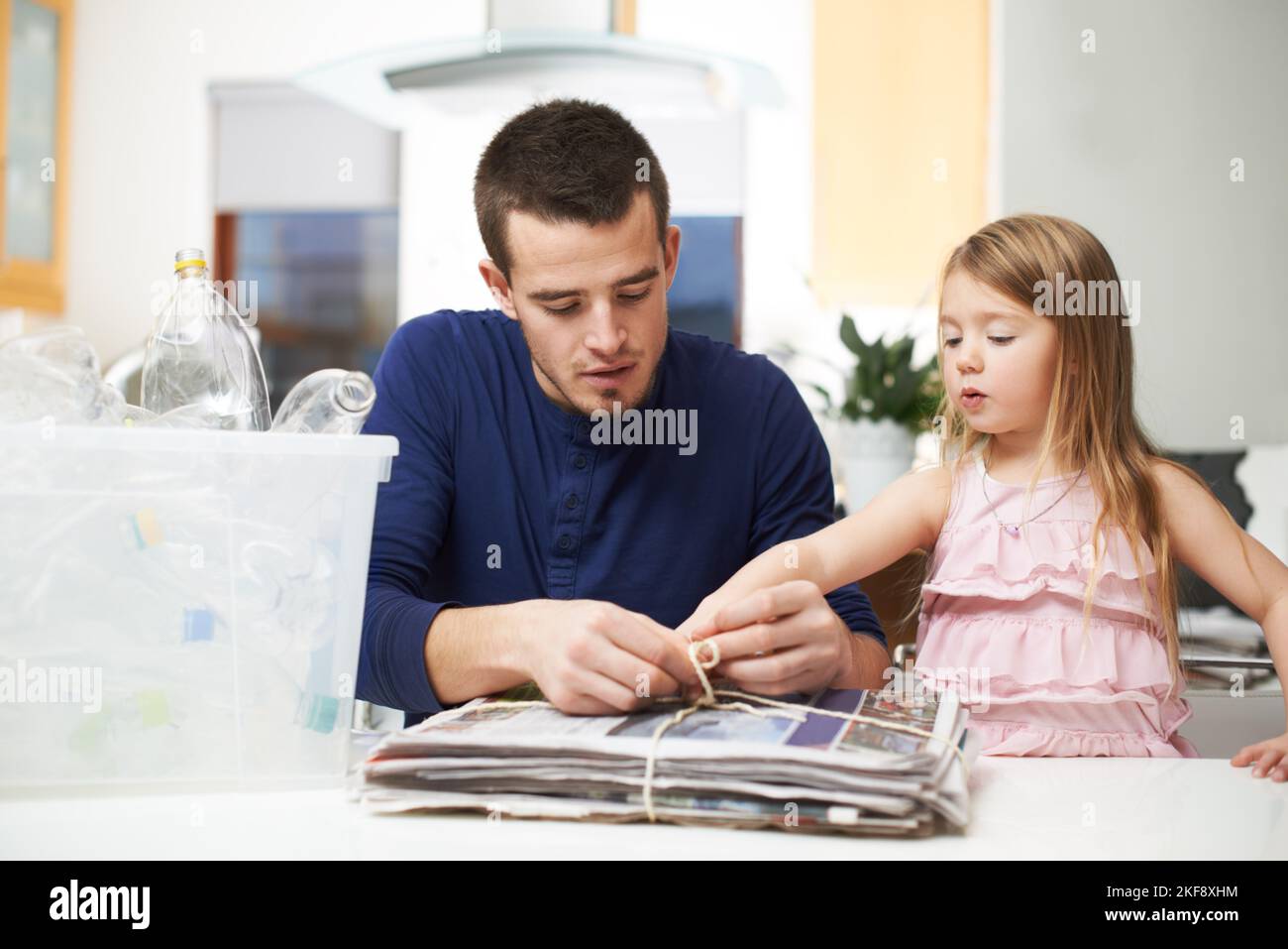 Daddys little helper. A young eco-friendly family working together to ...