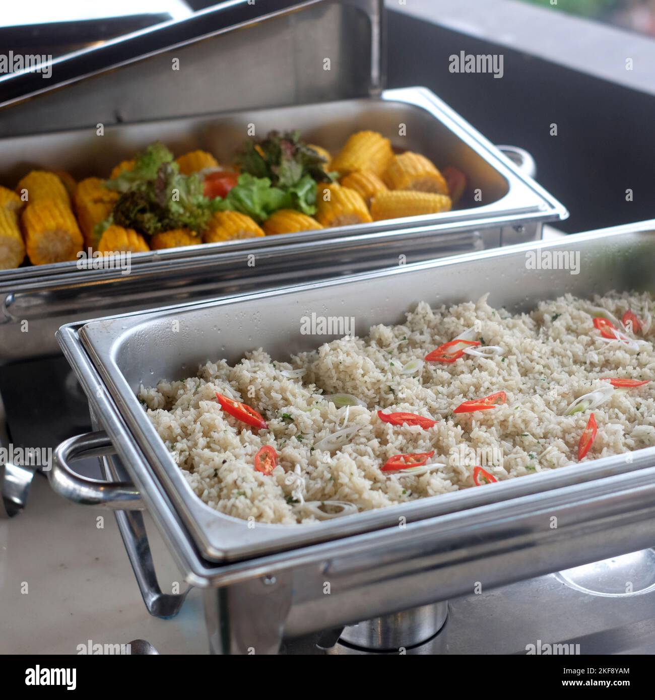 Hot White Rice served with chilly on Catering Set Buffet blur ...