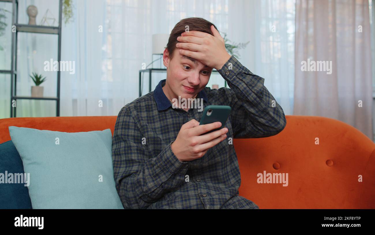 Portrait Of Teenager Adult Man Use Smartphone Typing Browsing Loses