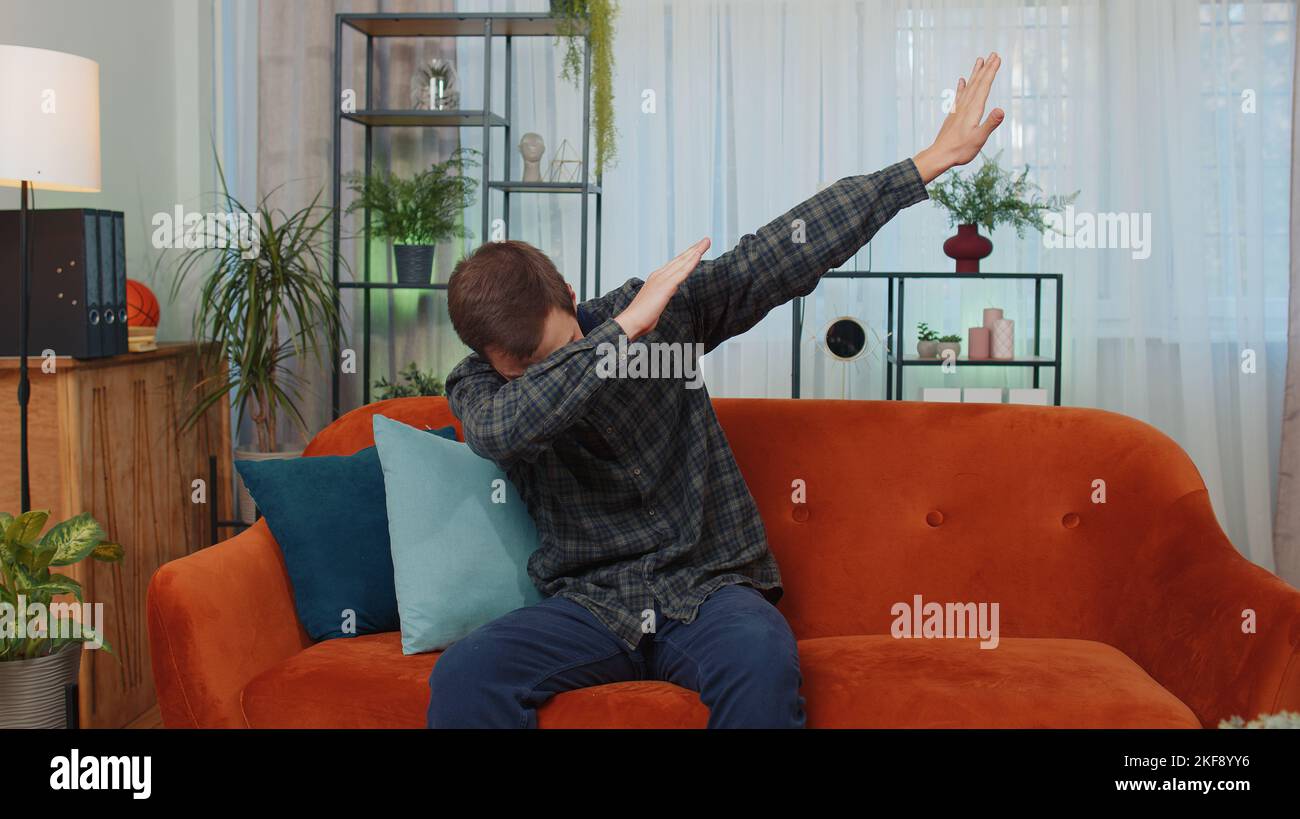 Trendy cheerful positive caucasian man having fun dancing and moving to ...