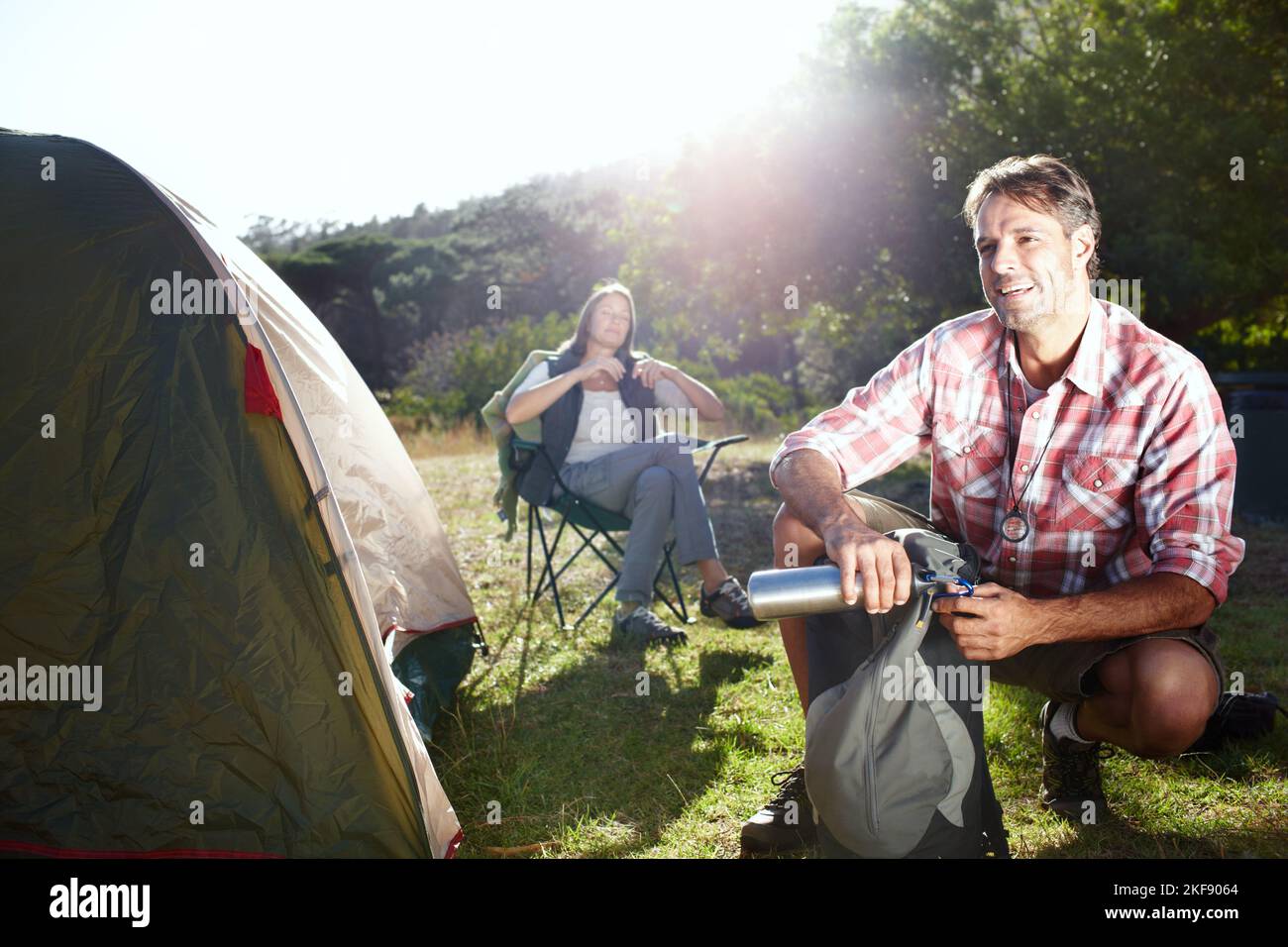 Getting ready for the big hike. Portrait of a young couple planning for ...