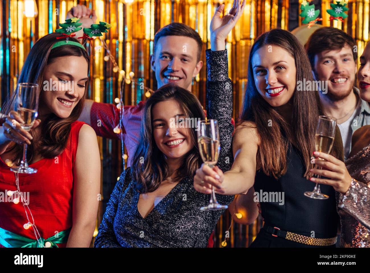 Group of friends celebrating New Year, Christmas party Stock Photo - Alamy