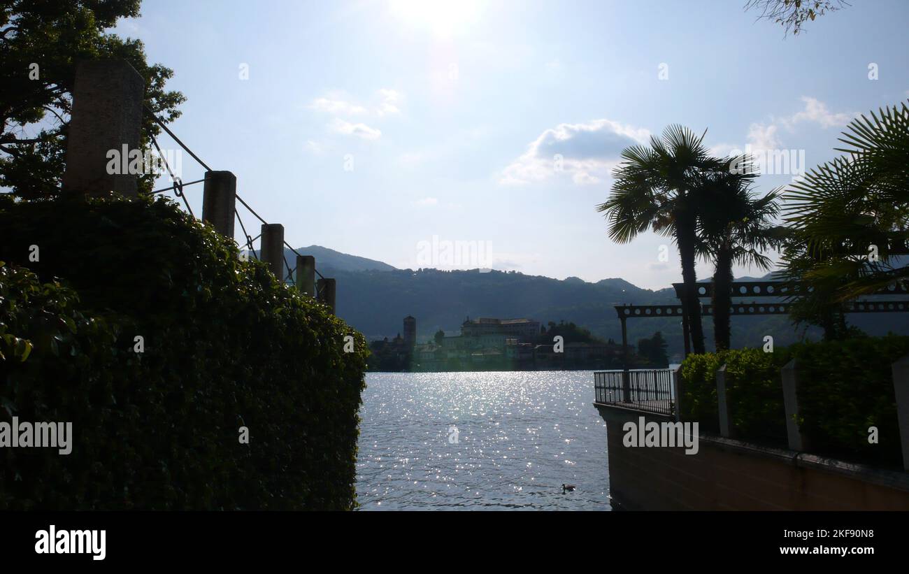 Lago Maggiore Italy mirroring Water contrast palm Stock Photo - Alamy