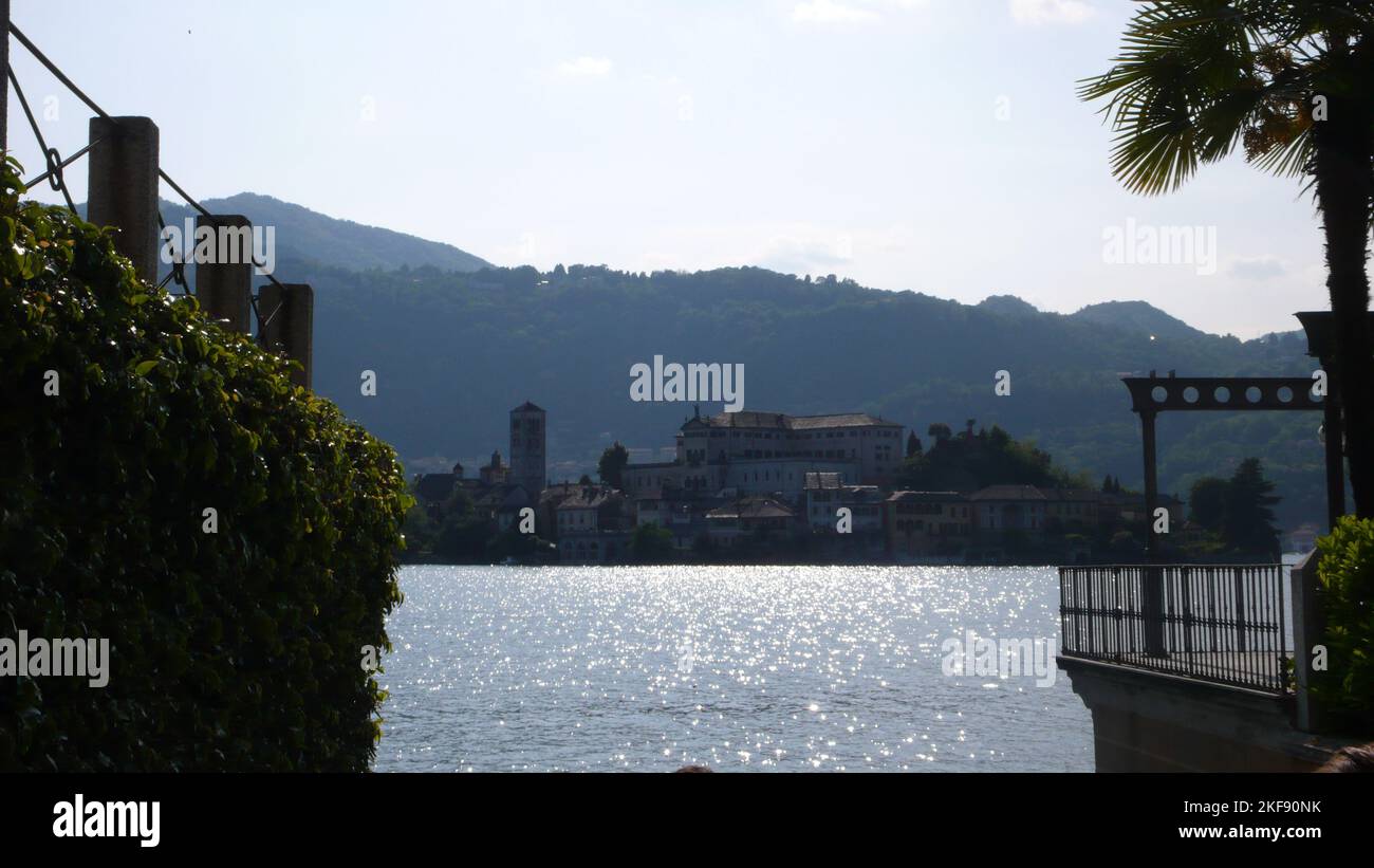 Lago Maggiore Italy mirroring Water contrast palm Stock Photo - Alamy