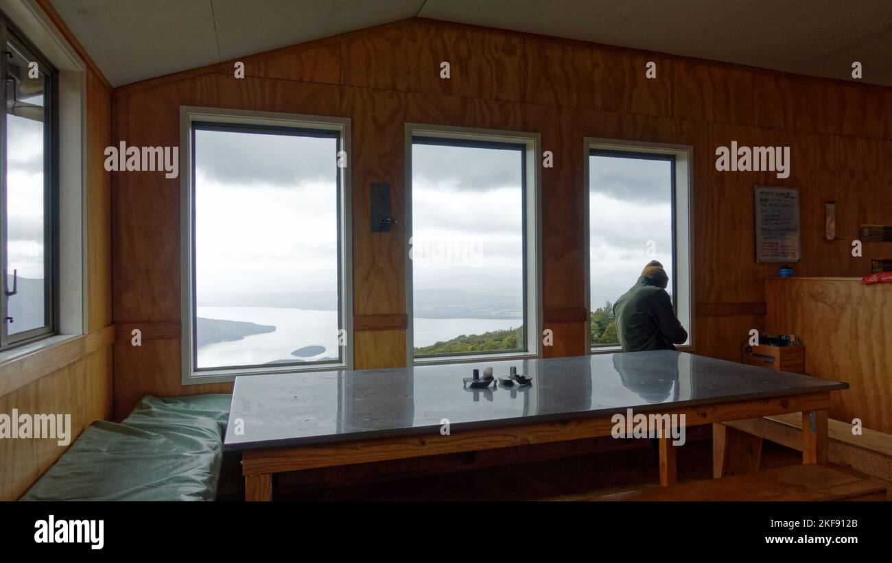 Inside the Luxmore hut on the Kepler Track looking out over Lake Te ...