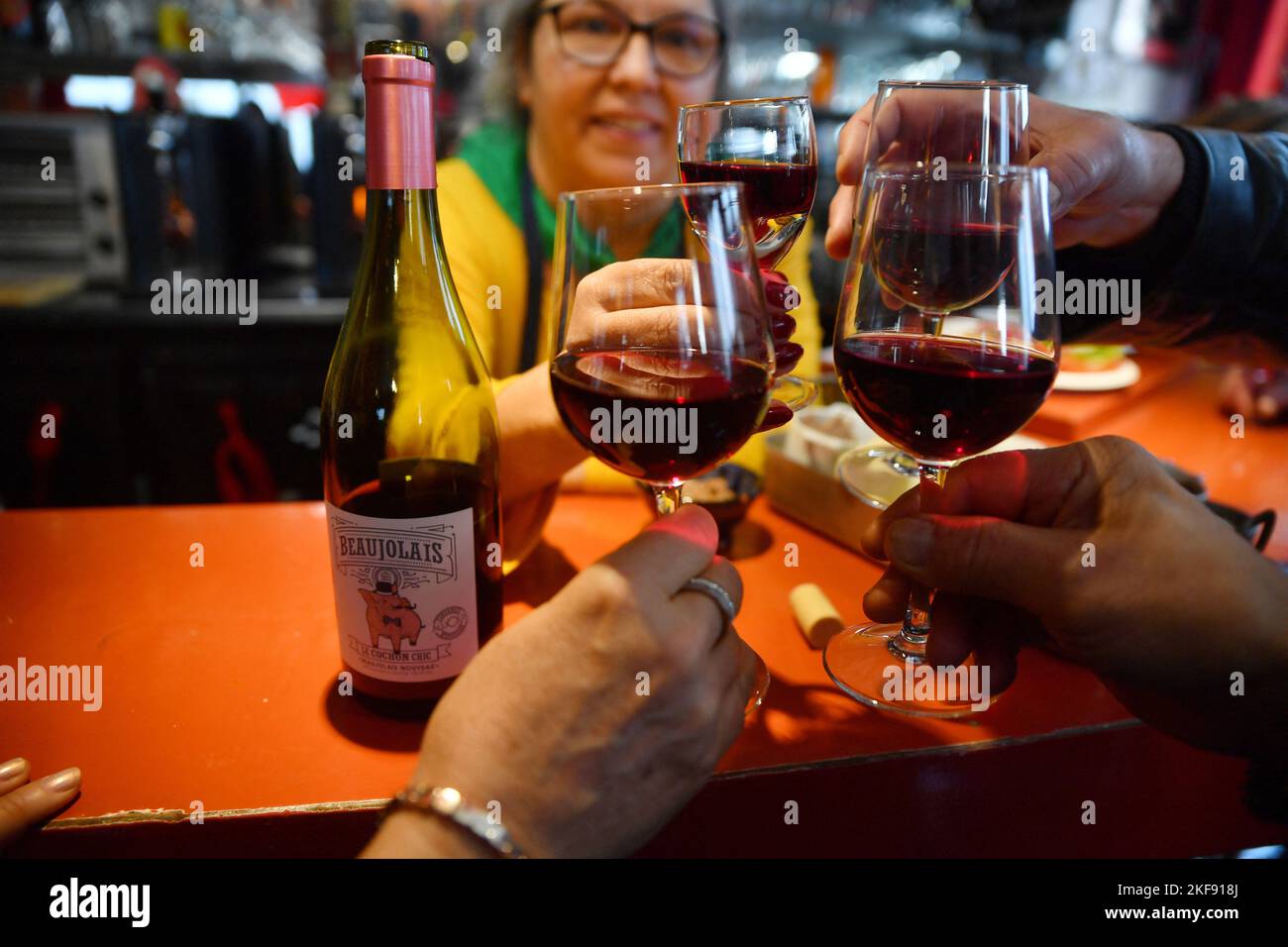 Wine fans celebrate the Beaujolais Nouveau's arrival in a bistrot on ...