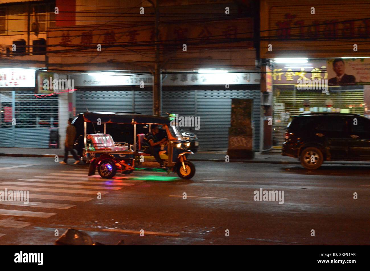 Tuk Tuk on Road in Bangkok Thailand at night Stock Photo - Alamy