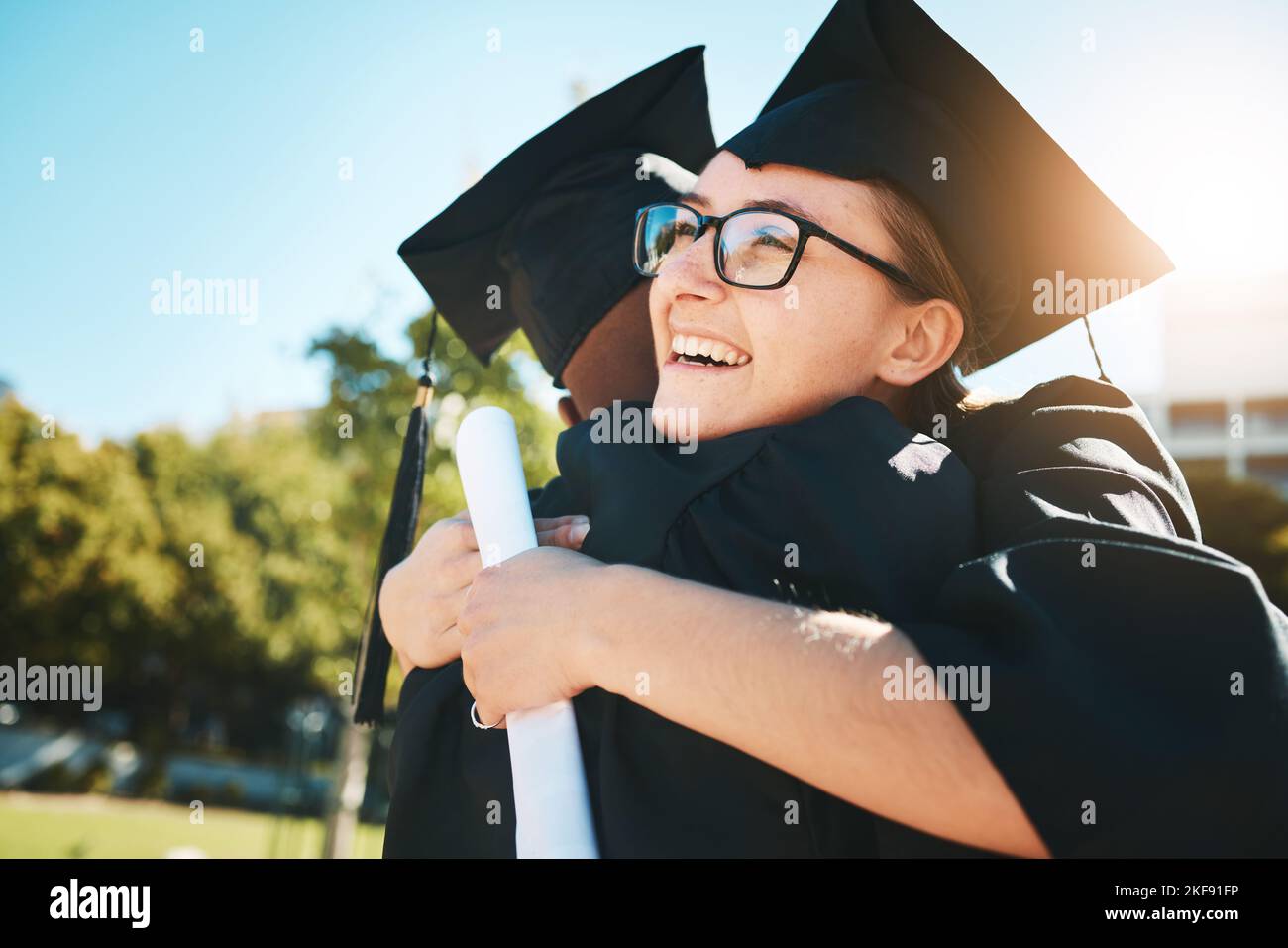 Graduation, hug and students with diploma from college for success ...